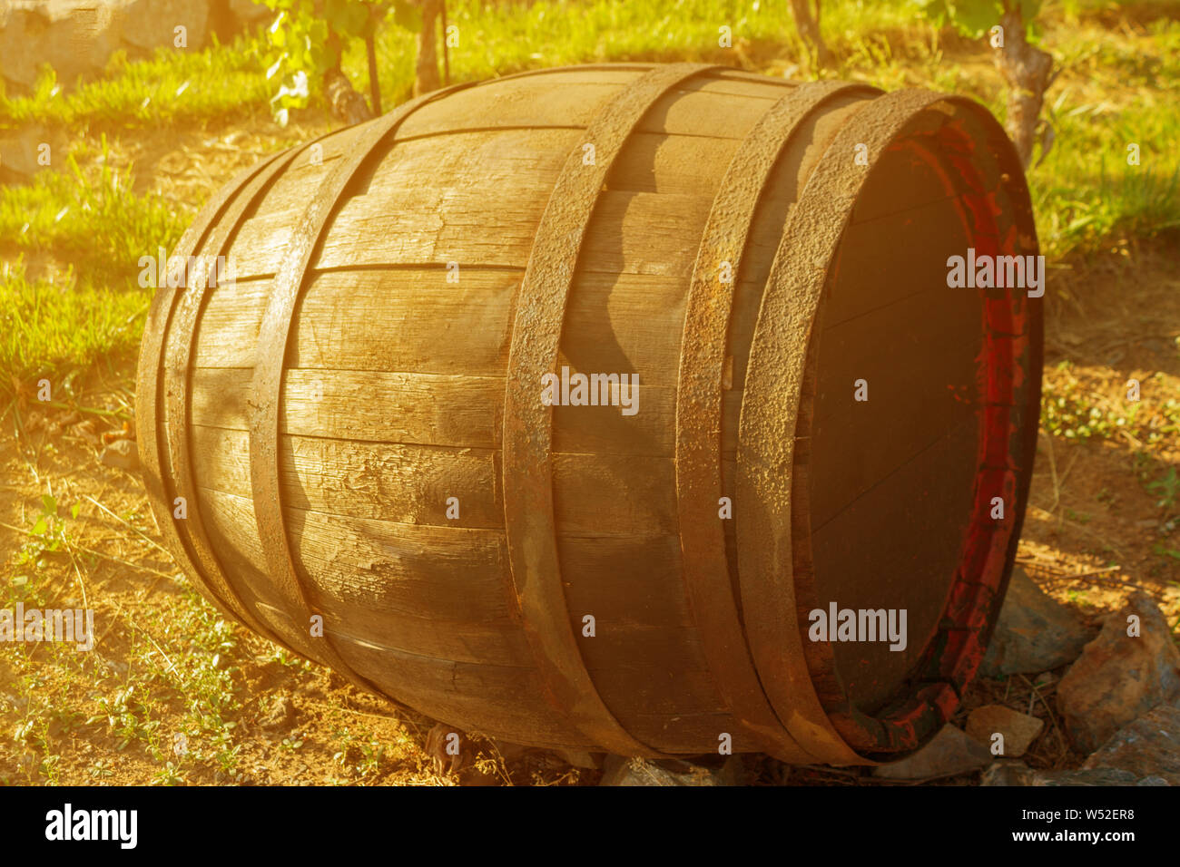single wooden cask with wine laying on the ground Stock Photo - Alamy