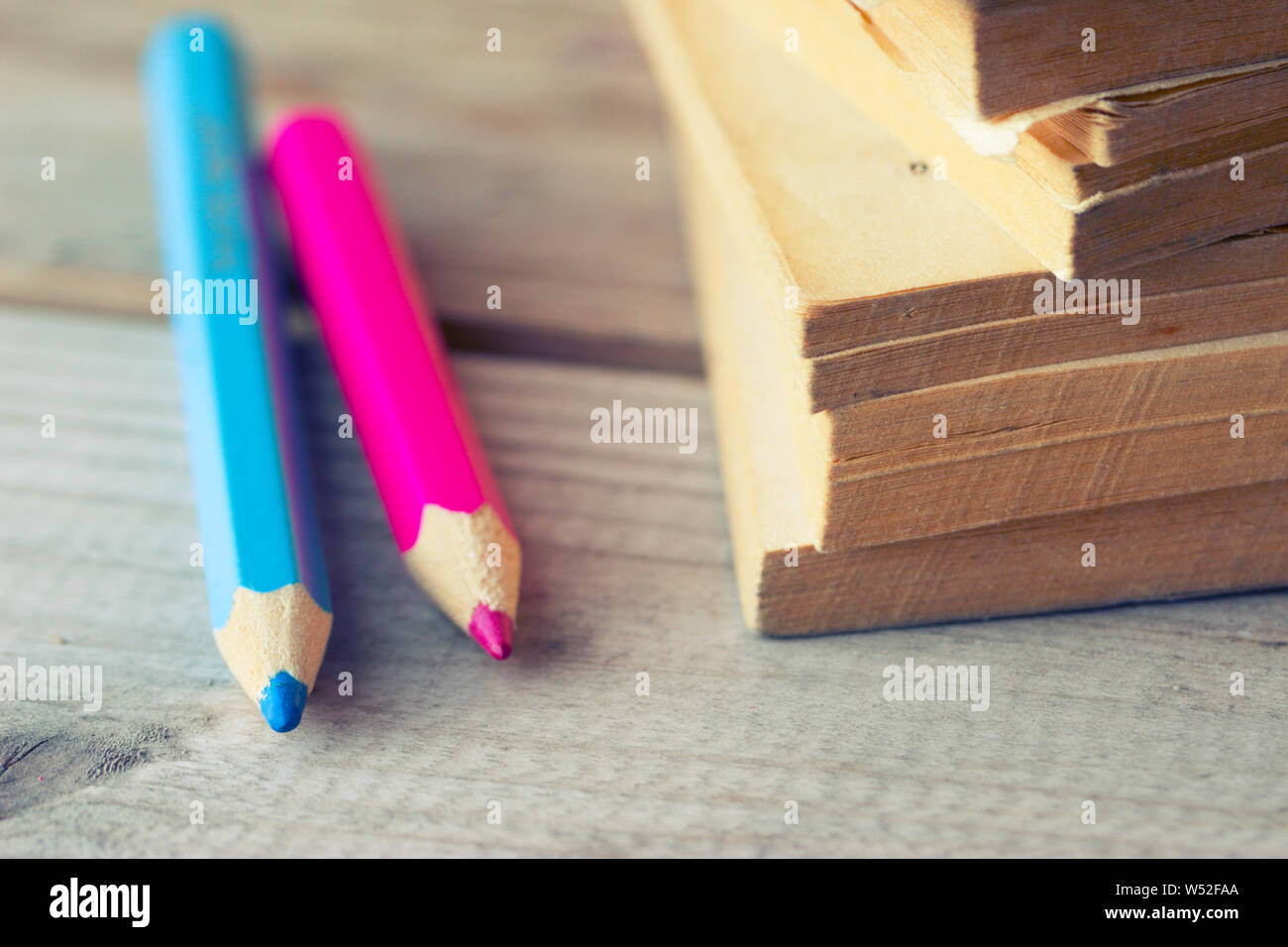 Stack of books and pencils. Close up Stock Photo - Alamy