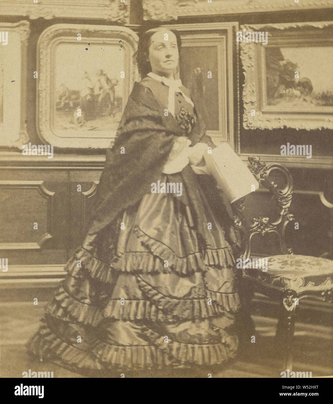 Woman posed in a parlor, paintings on the wall, Unknown, about 1860 ...
