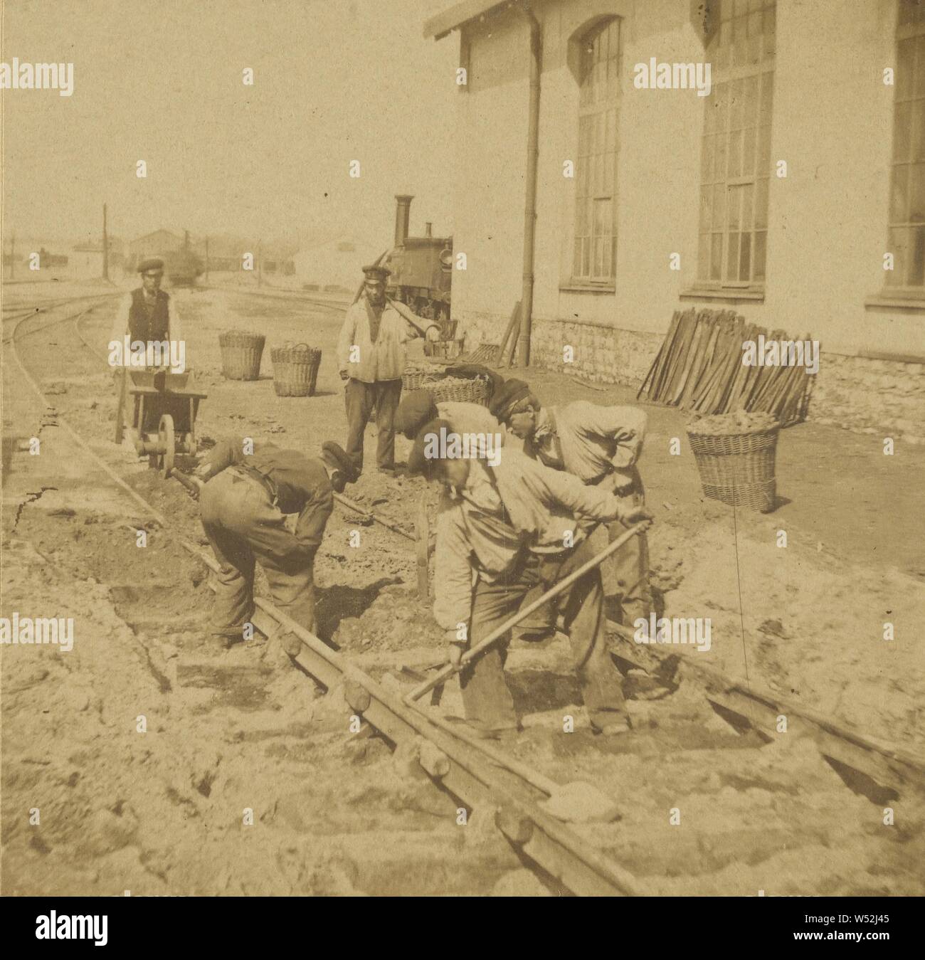 Men laying down train tracks, Unknown, about 1860, Albumen silver print ...