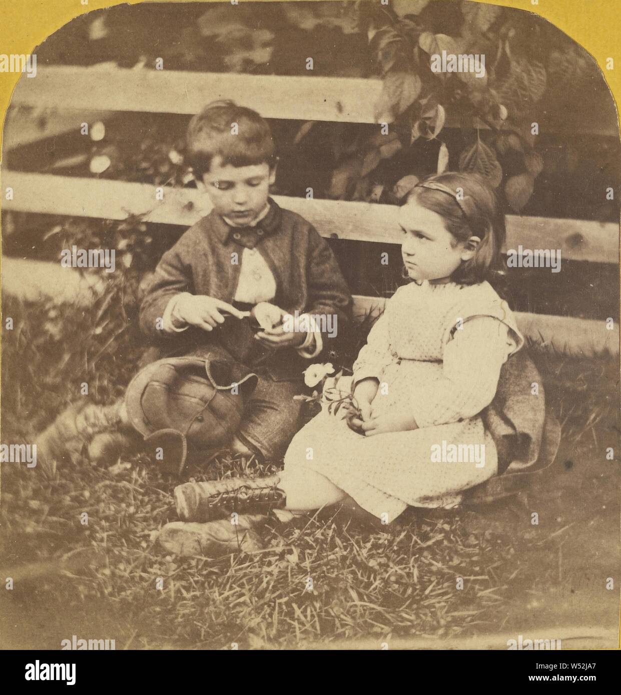 Little boy and girl posed on grass near fence, Unknown, about 1865 ...