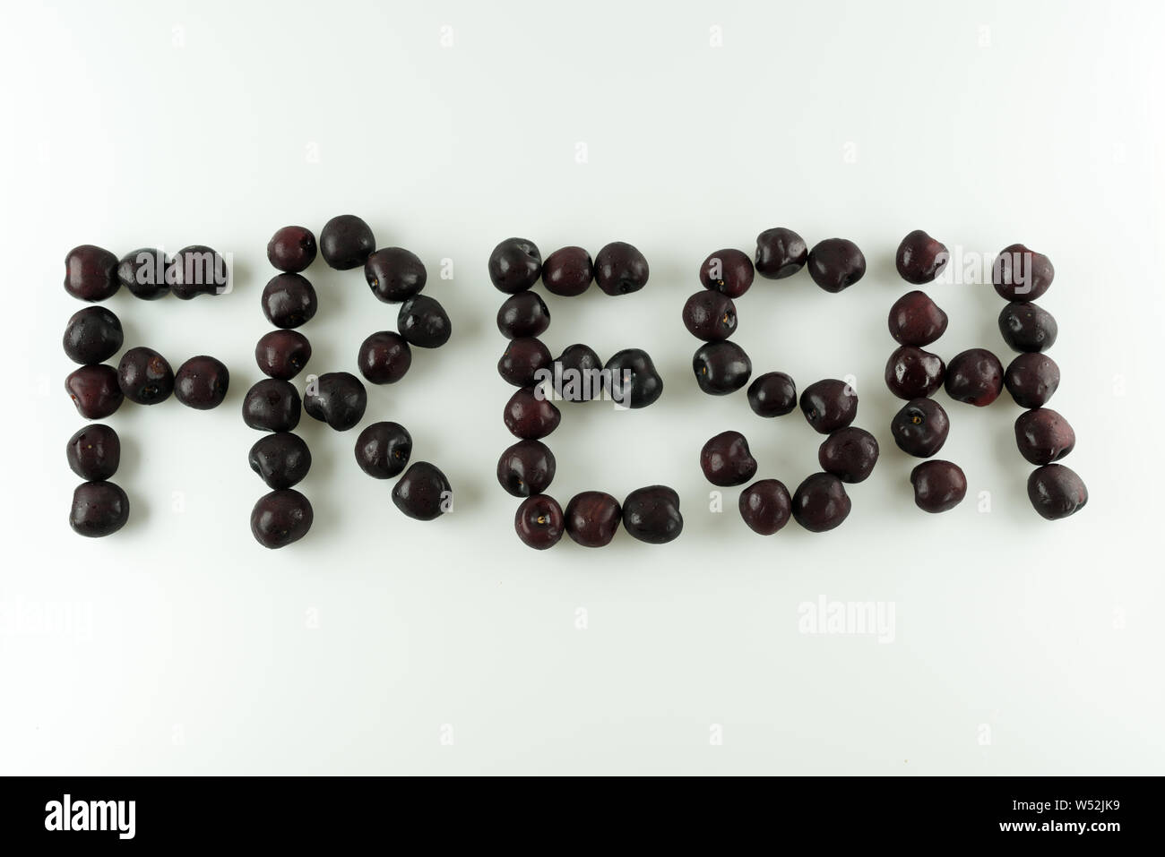 horizontal view of the word "fresh" written with fresh sweet and ripe ...