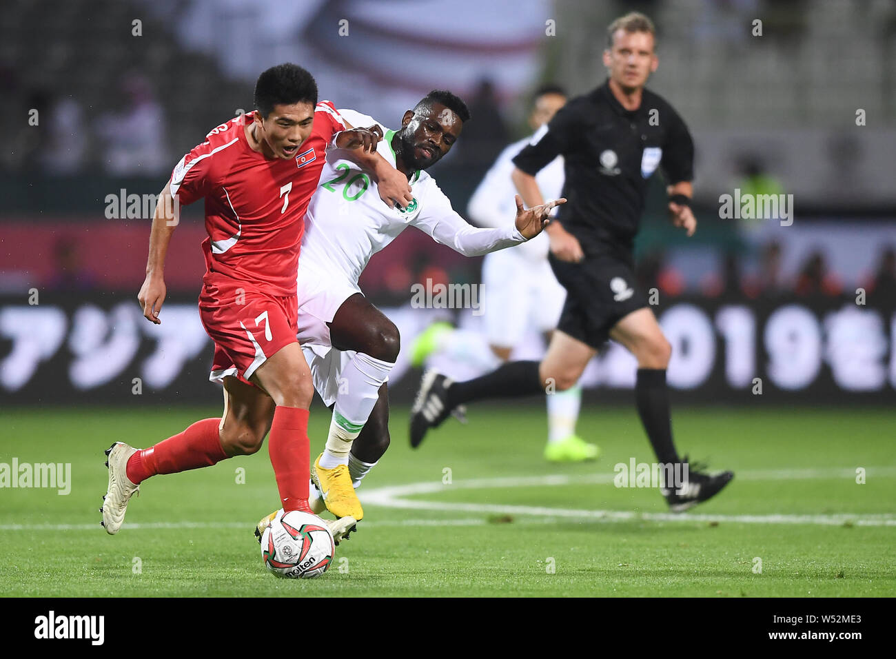 Han Kwang-song, left, of North Korea national football team passes the ...