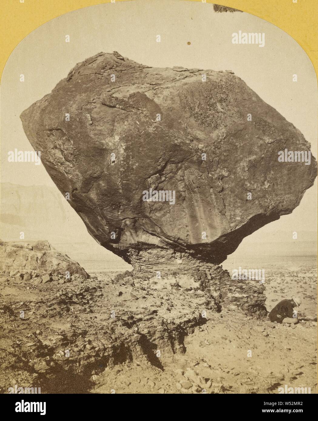 A perched block of sandstone, which is being gradually undermined by ...