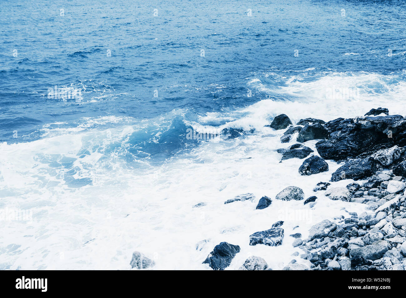 Restless sea near the stone coast. Natural landscape Stock Photo - Alamy