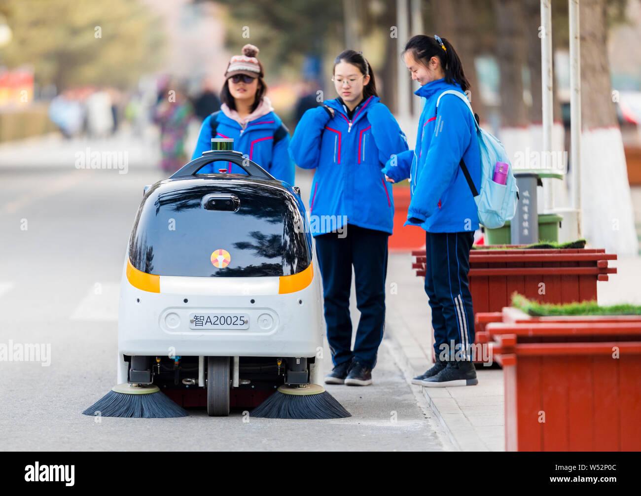 A Level 4 autonomous driving cleaning vehicle works at the campus of ...