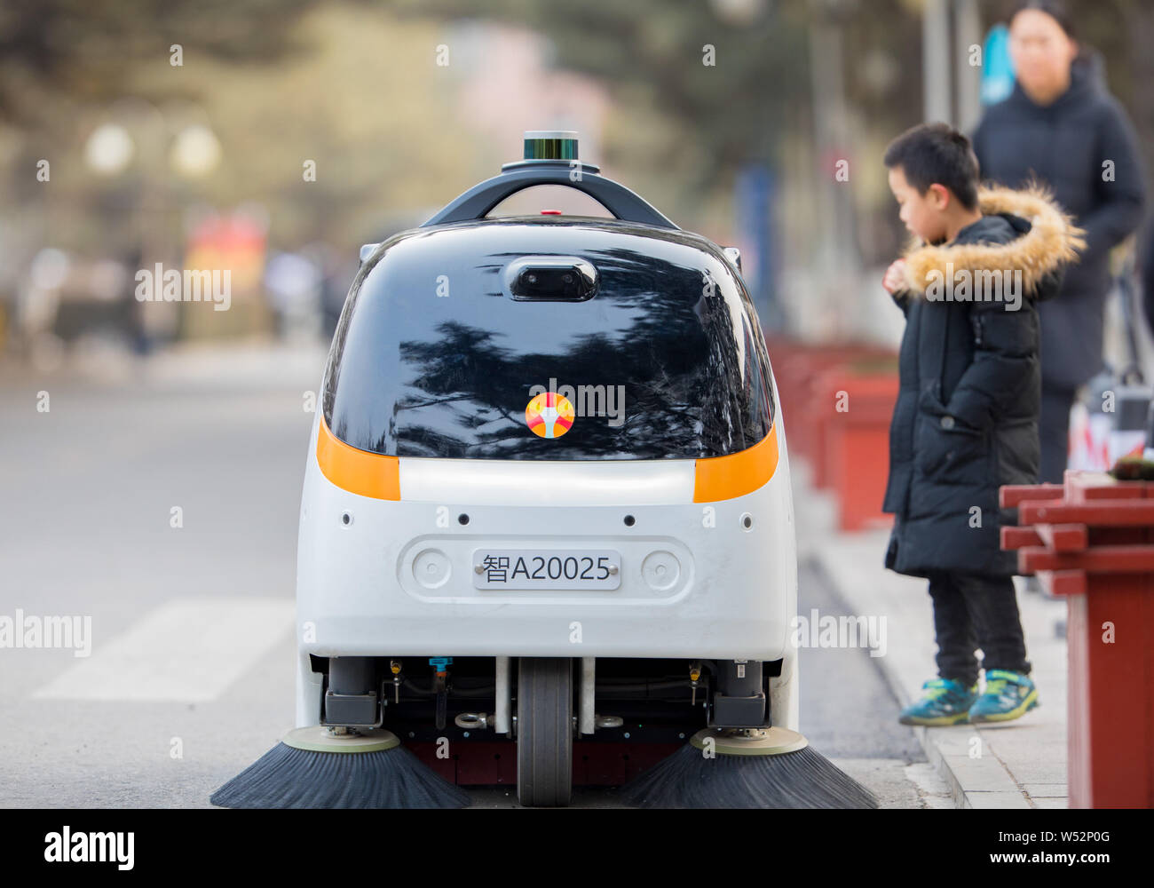 A Level 4 autonomous driving cleaning vehicle works at the campus of ...