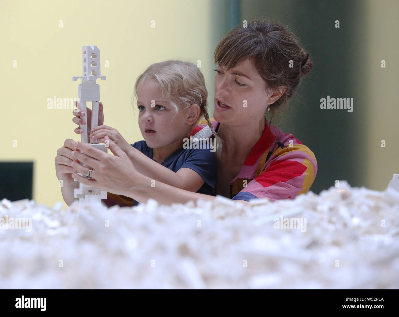 Elli Cartwright and her daughter Margot, aged 4, begin putting together ...