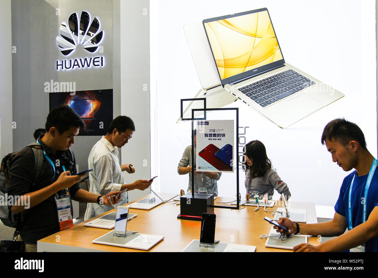 --FILE--People visit the stand of Huawei during an expo in Shanghai ...