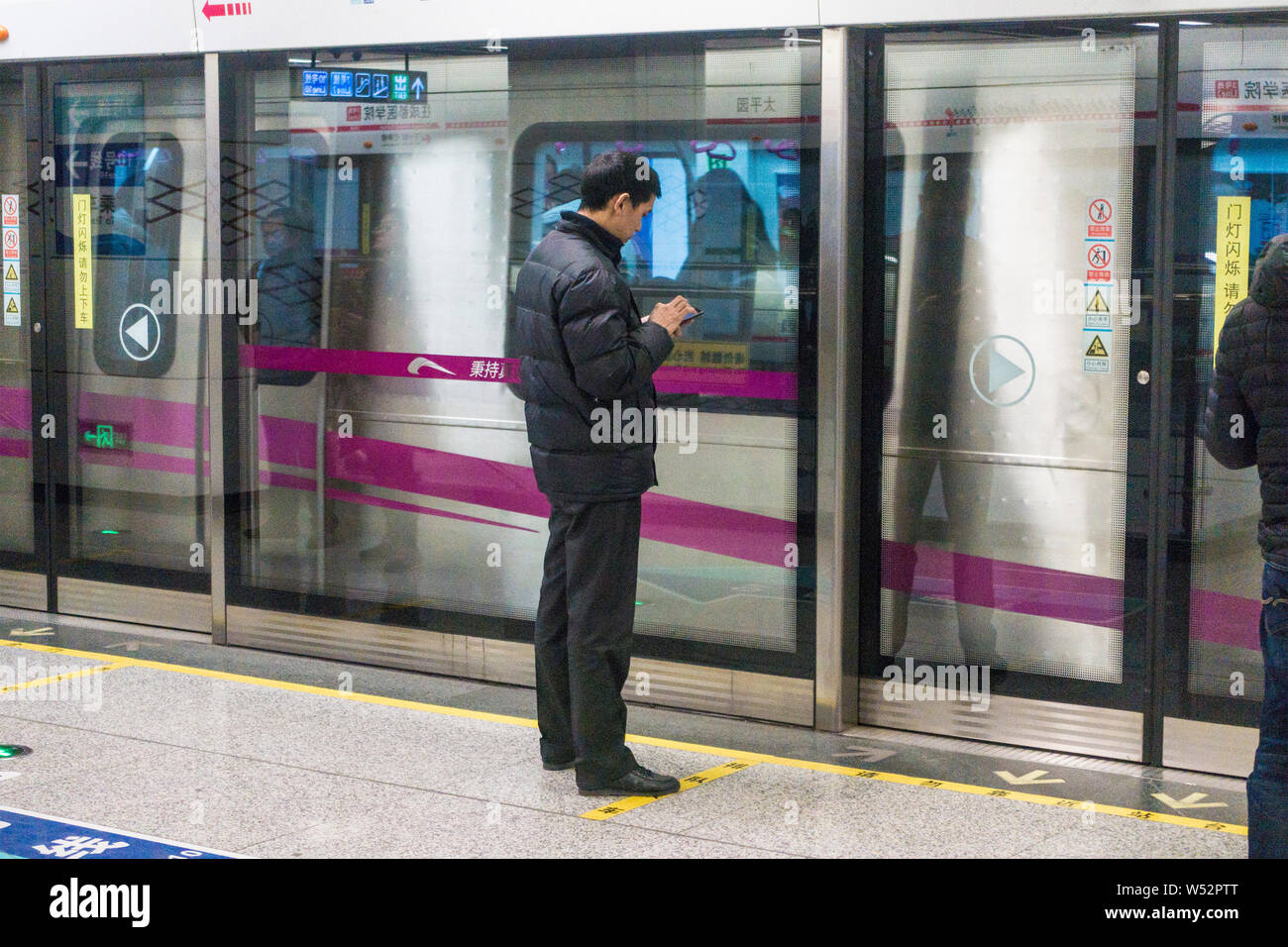 Passengers use smartphones at China's first 5G subway station ...