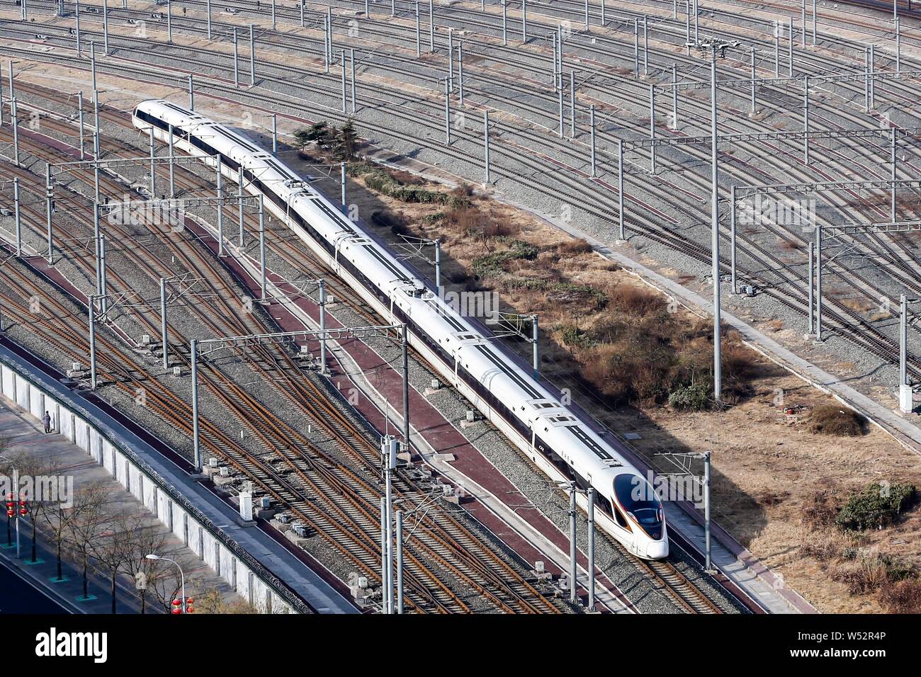A CRH (China Railway High-speed) bullet train leaves the Beijing South ...