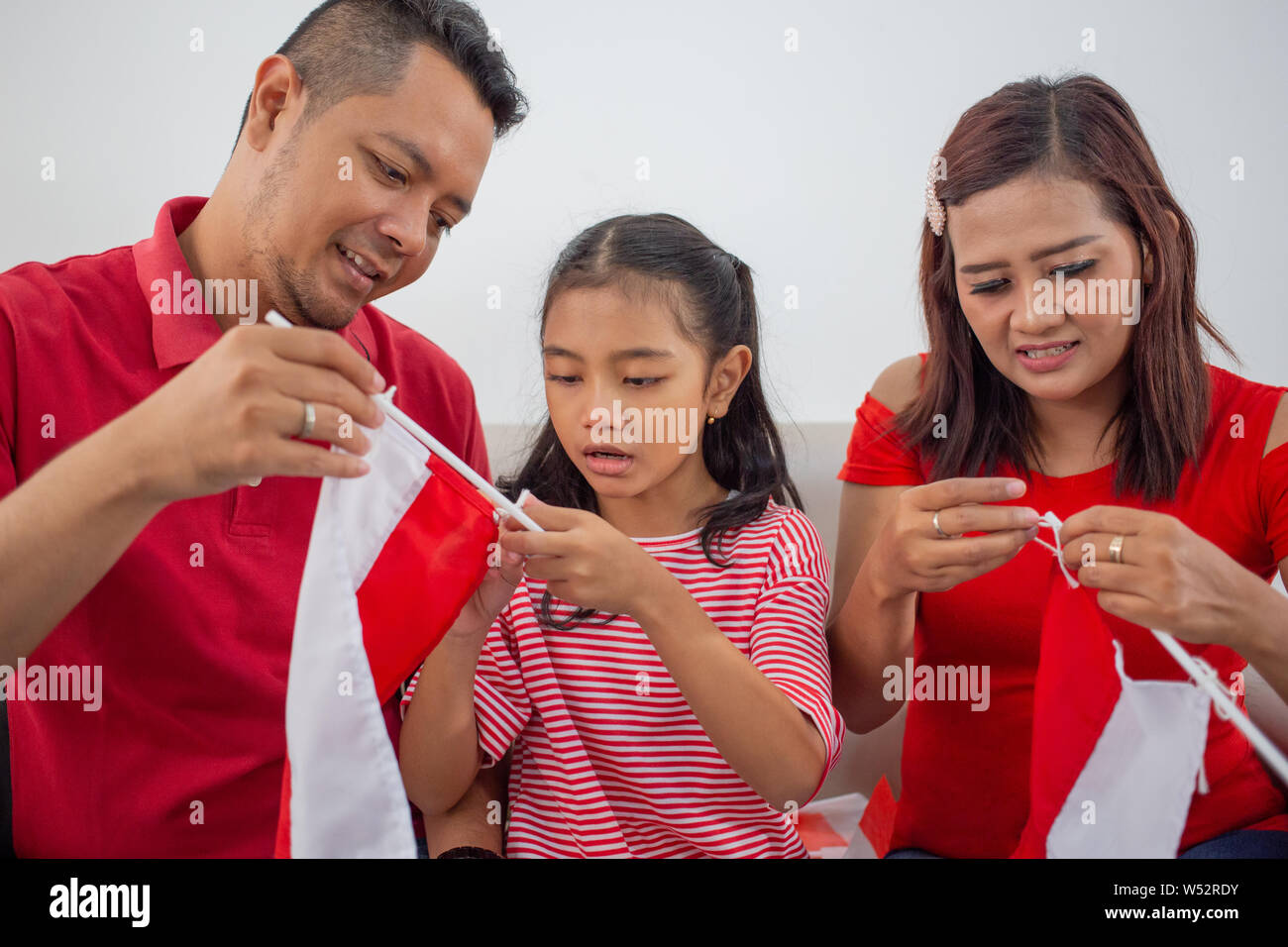 parent with daughter preparing and make their own indonesian flag Stock ...