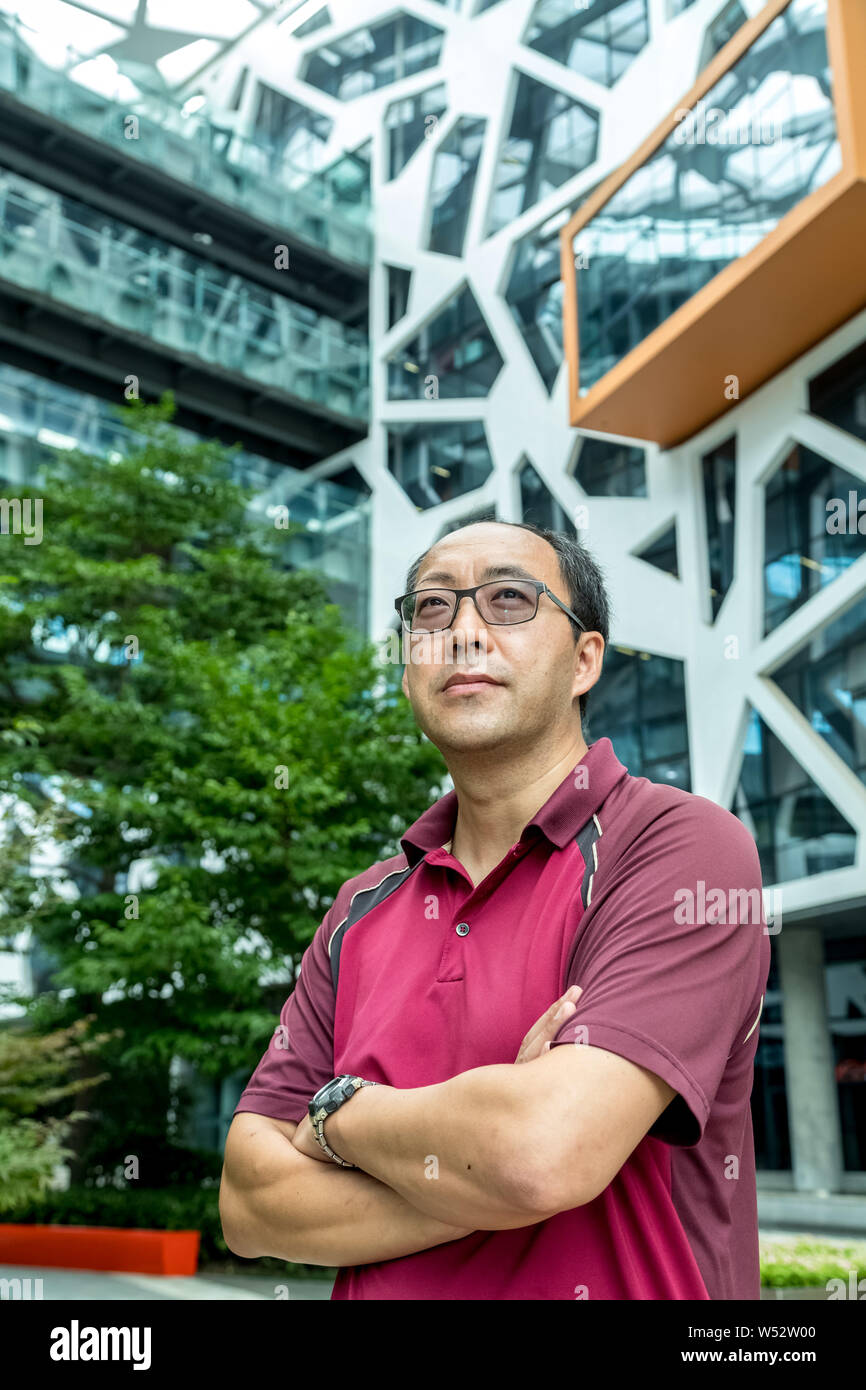 --FILE--Guo Dongbai, CTO at AliExpress, poses for photos during an ...