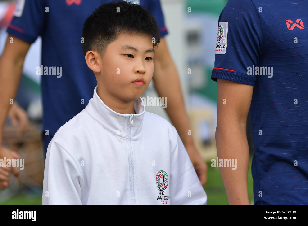 A Chinese ball kid poses before the Group A match between Bahrain and ...