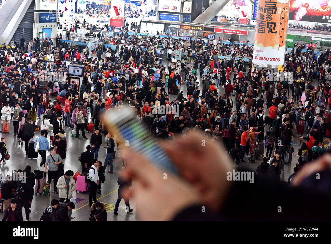 Passengers wait for their trains to go back home for the Chinese Lunar ...