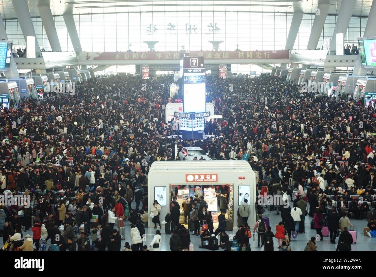 Passengers wait for their trains to go back home for the Chinese Lunar ...
