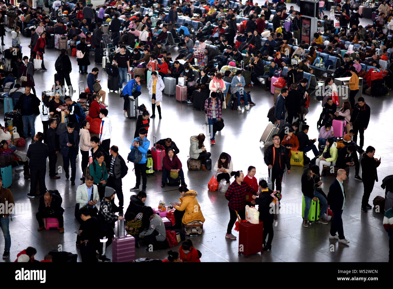 Passengers wait for their trains to go back home for the Chinese Lunar ...