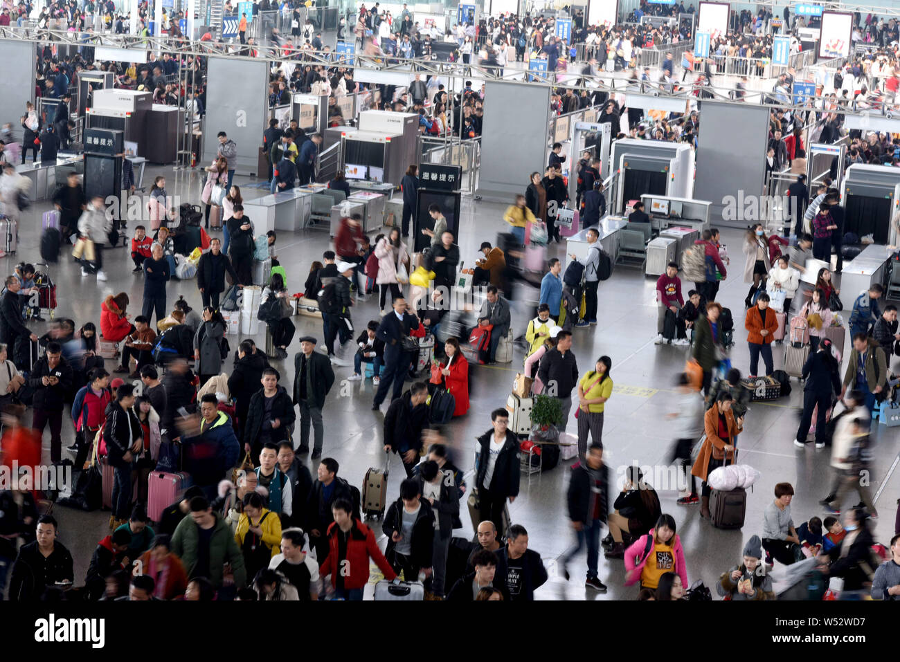 Passengers wait for their trains to go back home for the Chinese Lunar ...