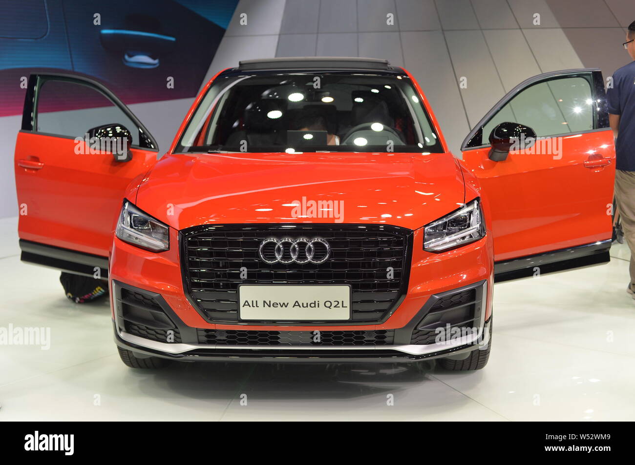 --FILE--Visitors try out an All New Audi Q2L displayed during an ...