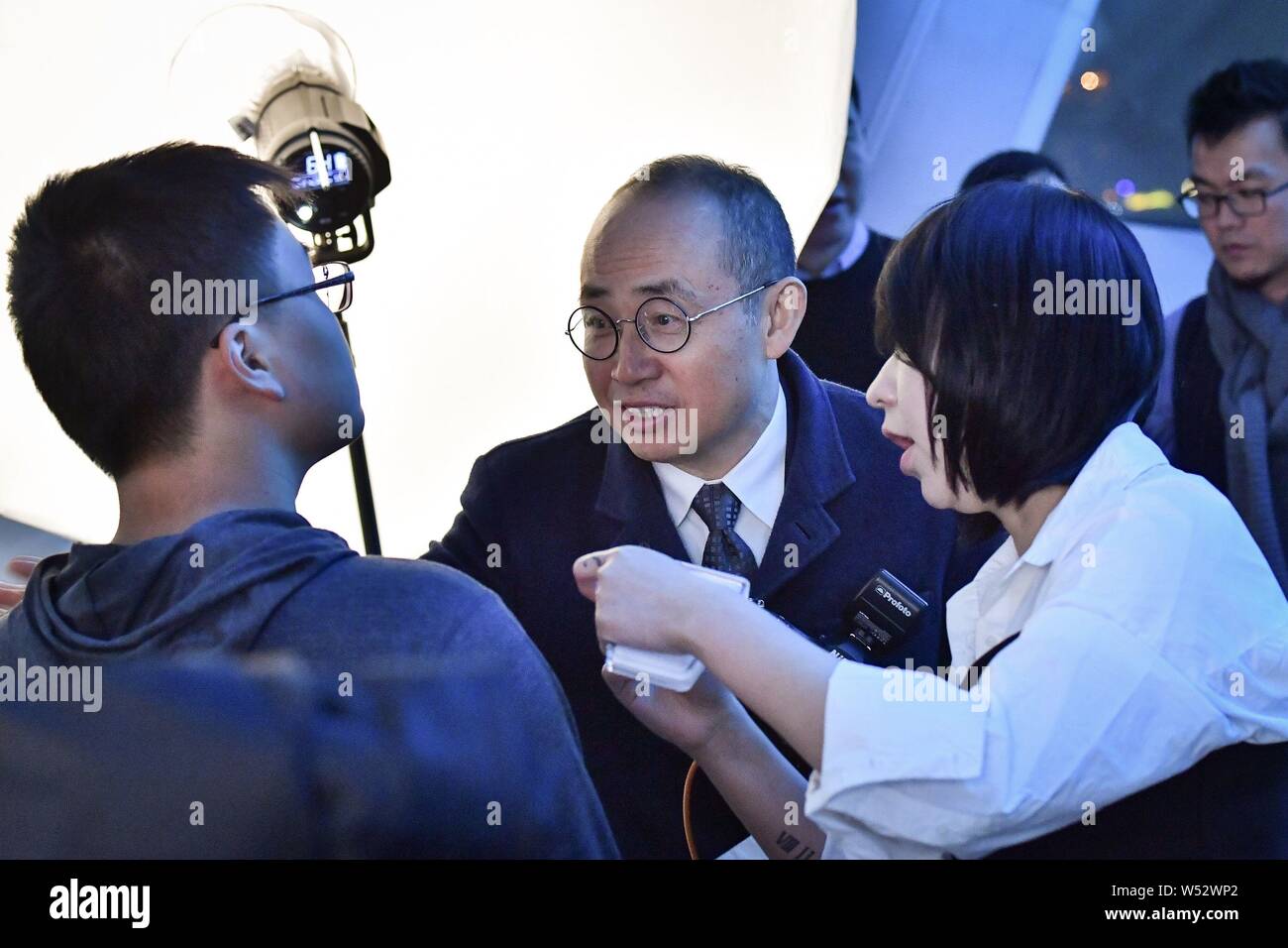 Pan Shiyi, co-founder, Chairman and co-CEO of SOHO China, takes photos ...