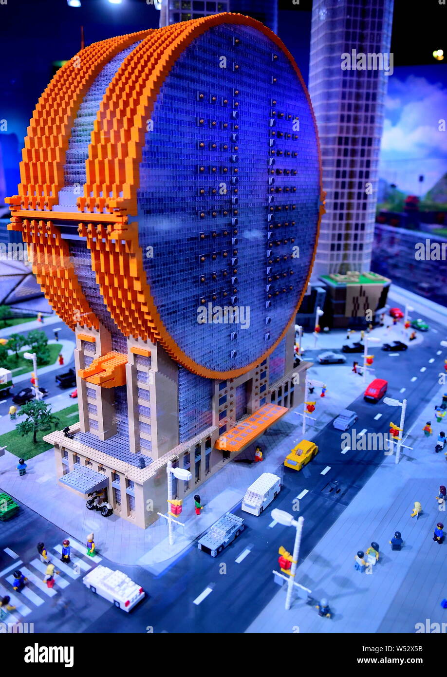 The Coin-shaped Fang Yuan Building made by Lego bricks is on display at ...