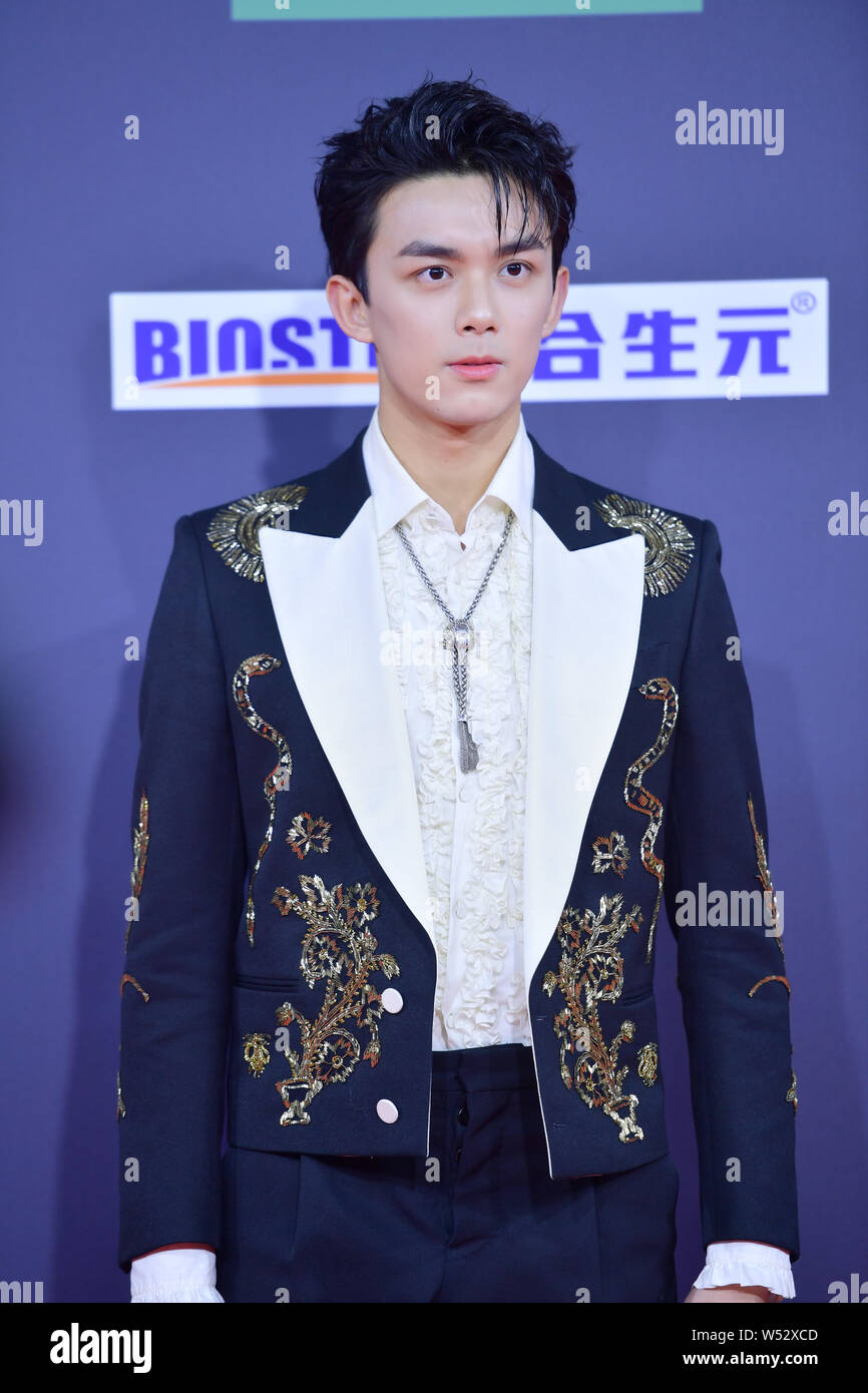 Chinese actor Leo Wu Lei, known as the "Nation's Little Brother", poses as he arrives on the red ...