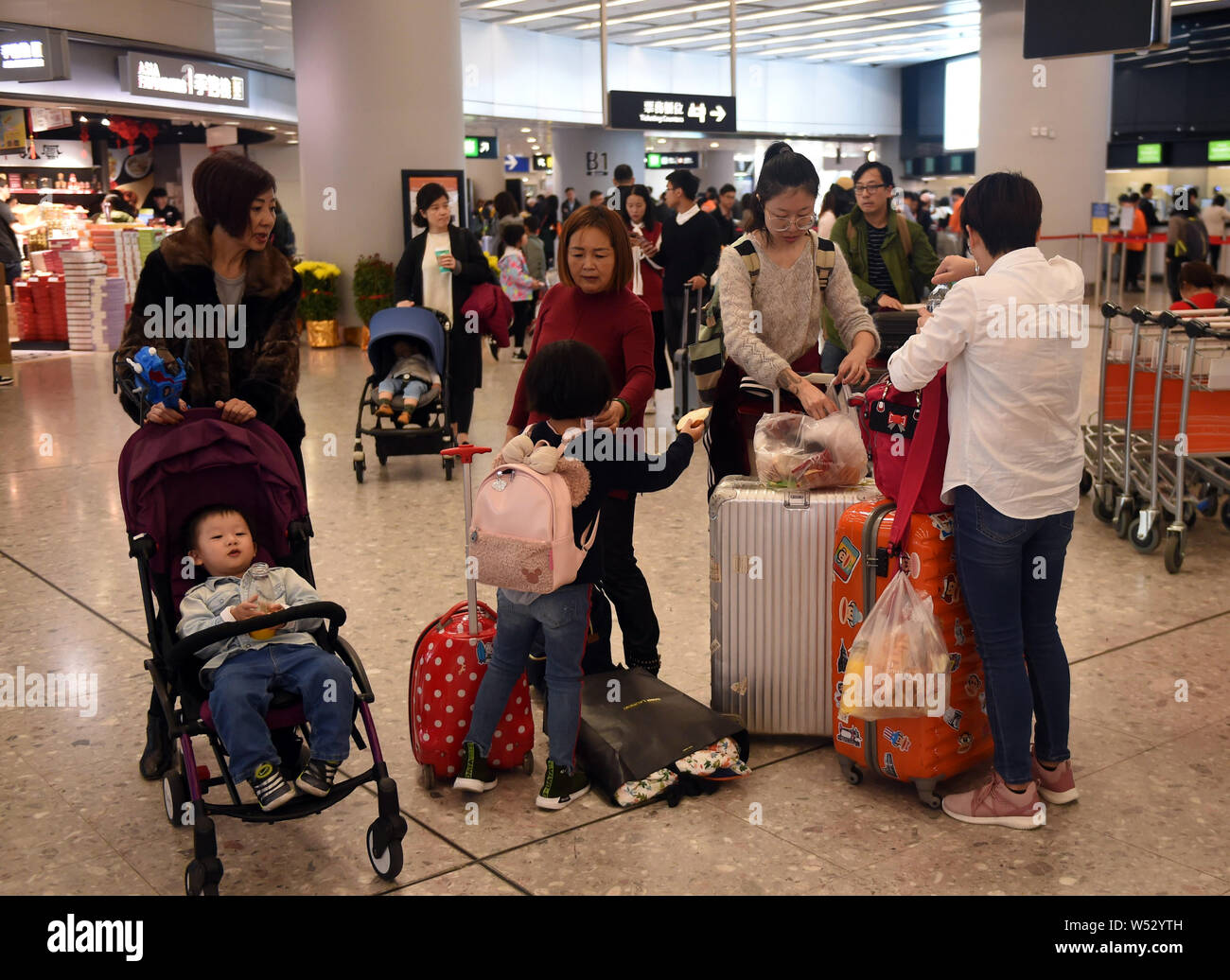 Passengers wait for their trains during the Spring Festival travel rush ...