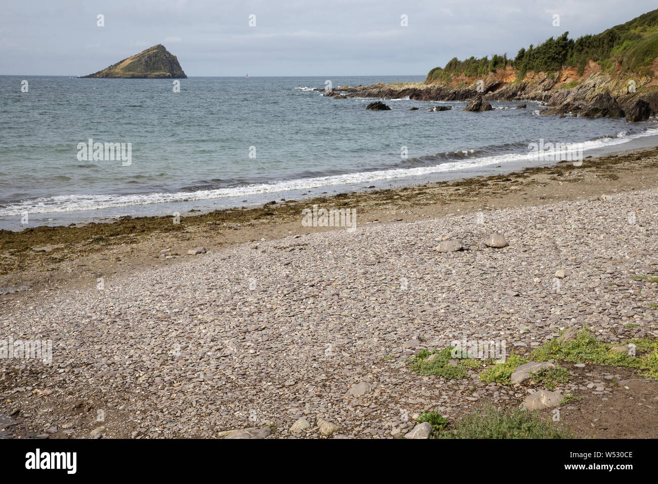 the beach at wembury with the great mewstone in the distance on the ...