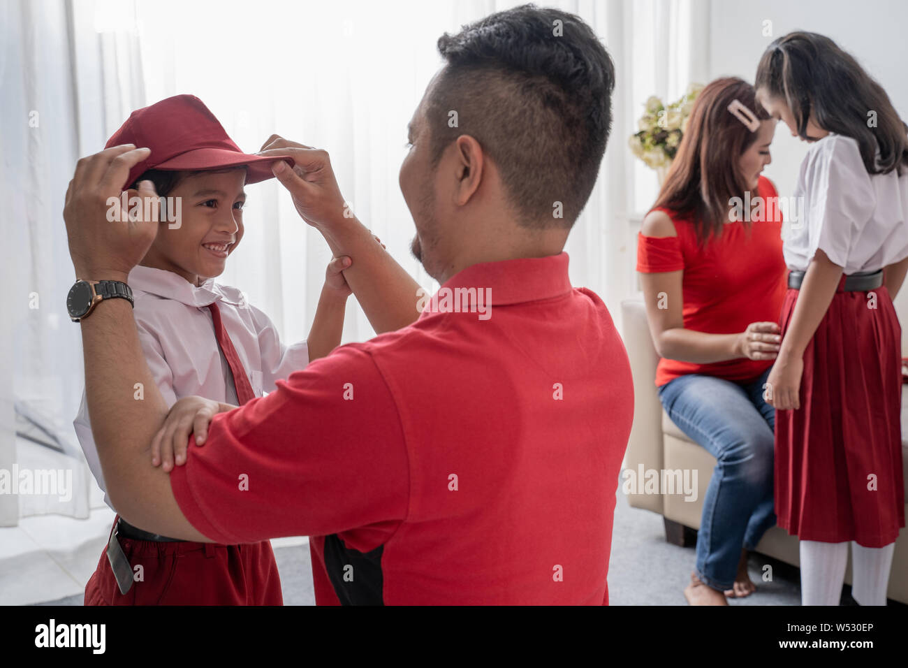 parent help their children getting ready for school Stock Photo - Alamy
