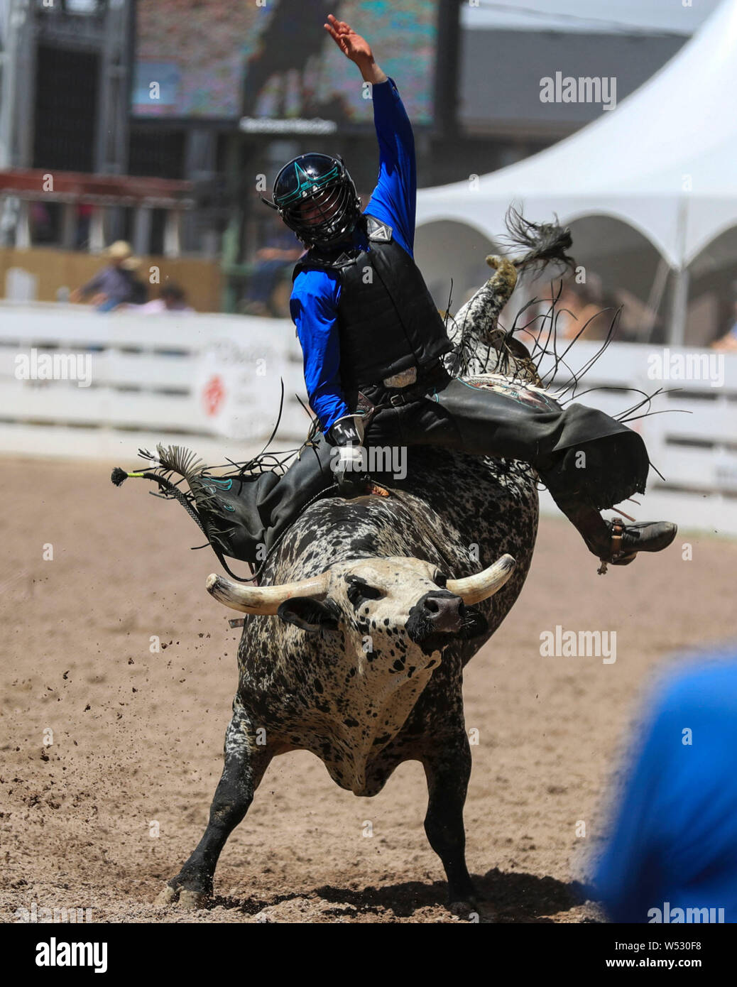Cheyenne, USA. 25th July, 2019. A rider competes during the bull riding ...
