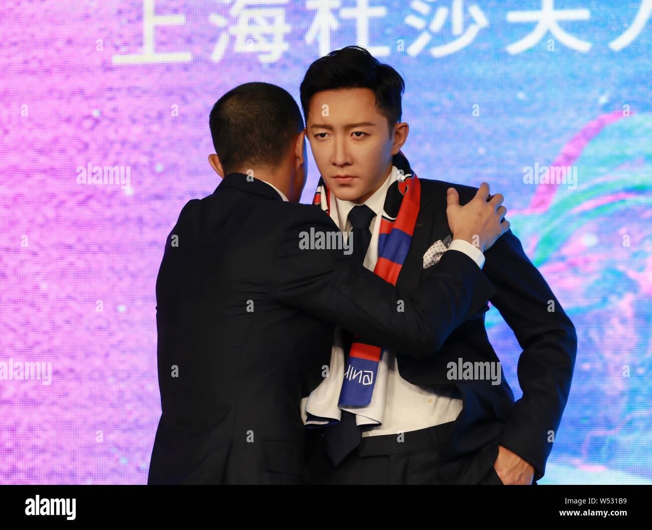 Chinese singer and actor Han Geng attends an unveiling ceremony of his ...