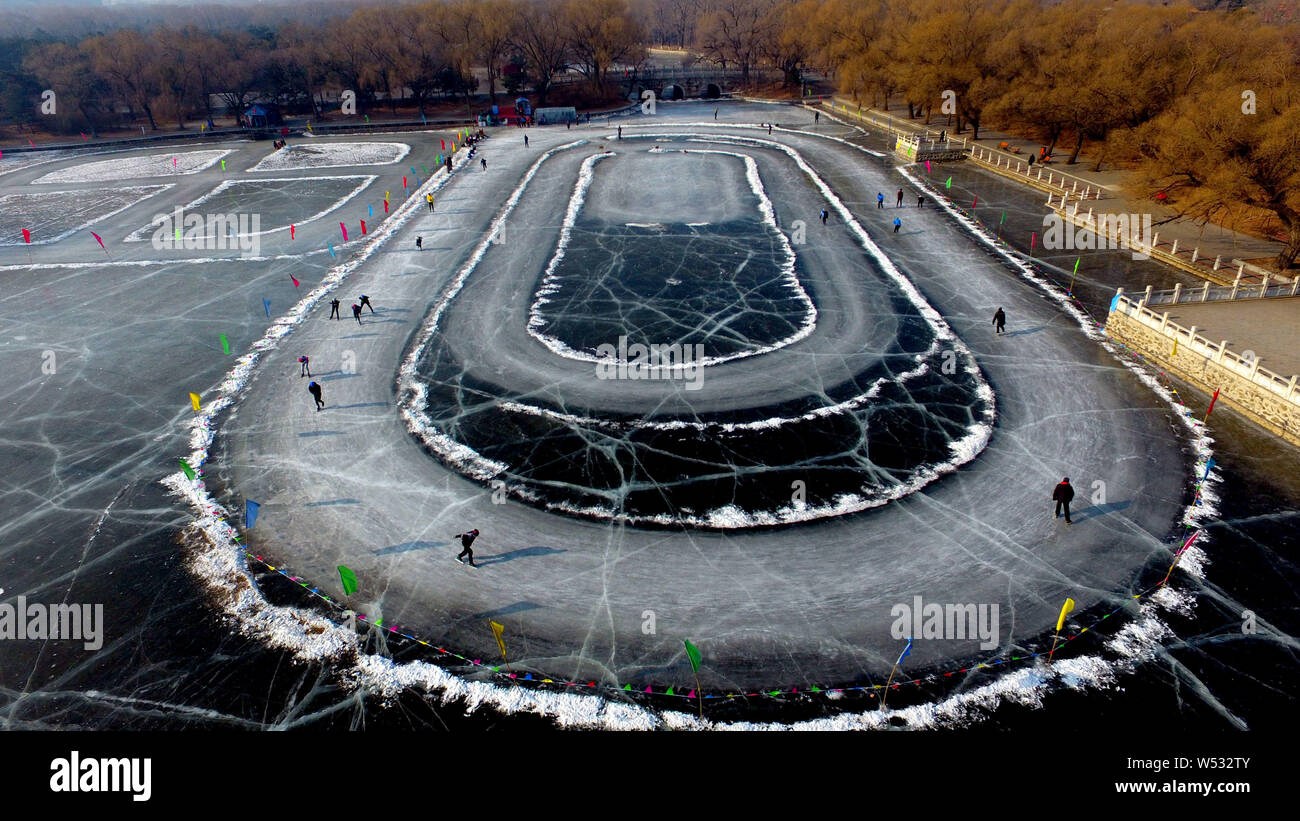 Visitors ice-skate on a 300-meter-long icy racetrack near the Zhaoling ...