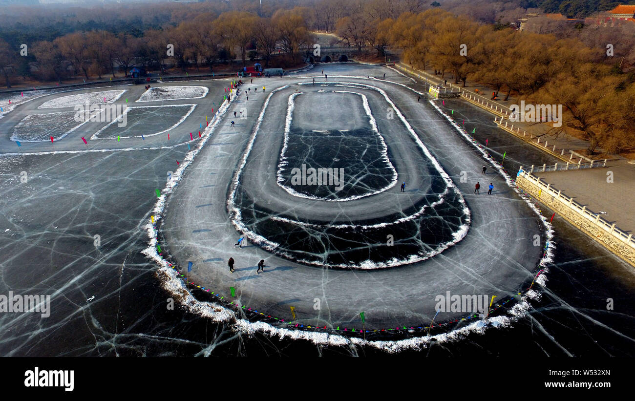 Visitors ice-skate on a 300-meter-long icy racetrack near the Zhaoling ...