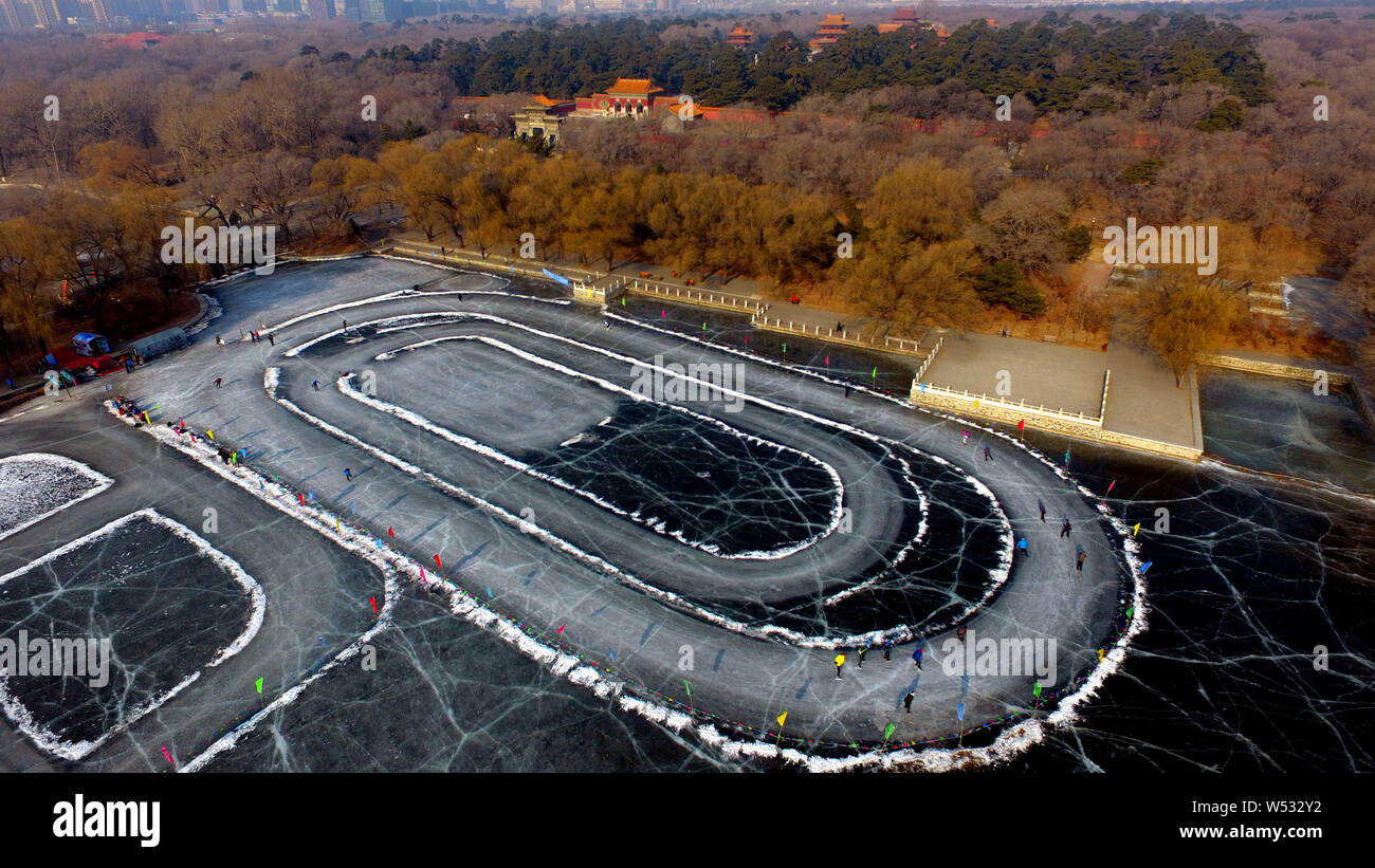 Visitors ice-skate on a 300-meter-long icy racetrack near the Zhaoling ...