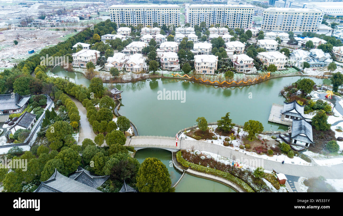 Landscape of a park covered with snow after a heavy snowfall in Hai'an ...