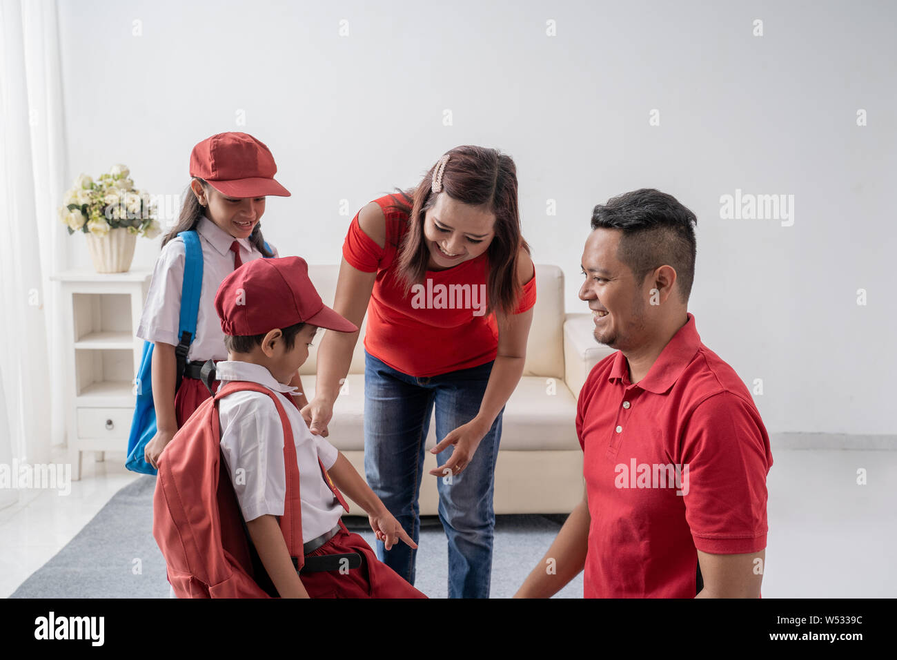 parent help their children getting ready for school Stock Photo - Alamy