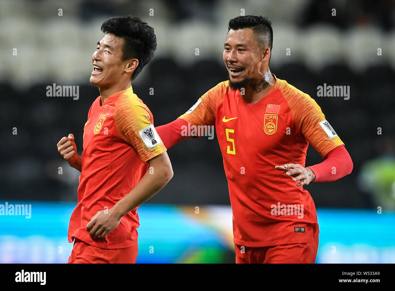 Wu Lei, left, and Zhang Linpeng of China celebrate after scoring ...