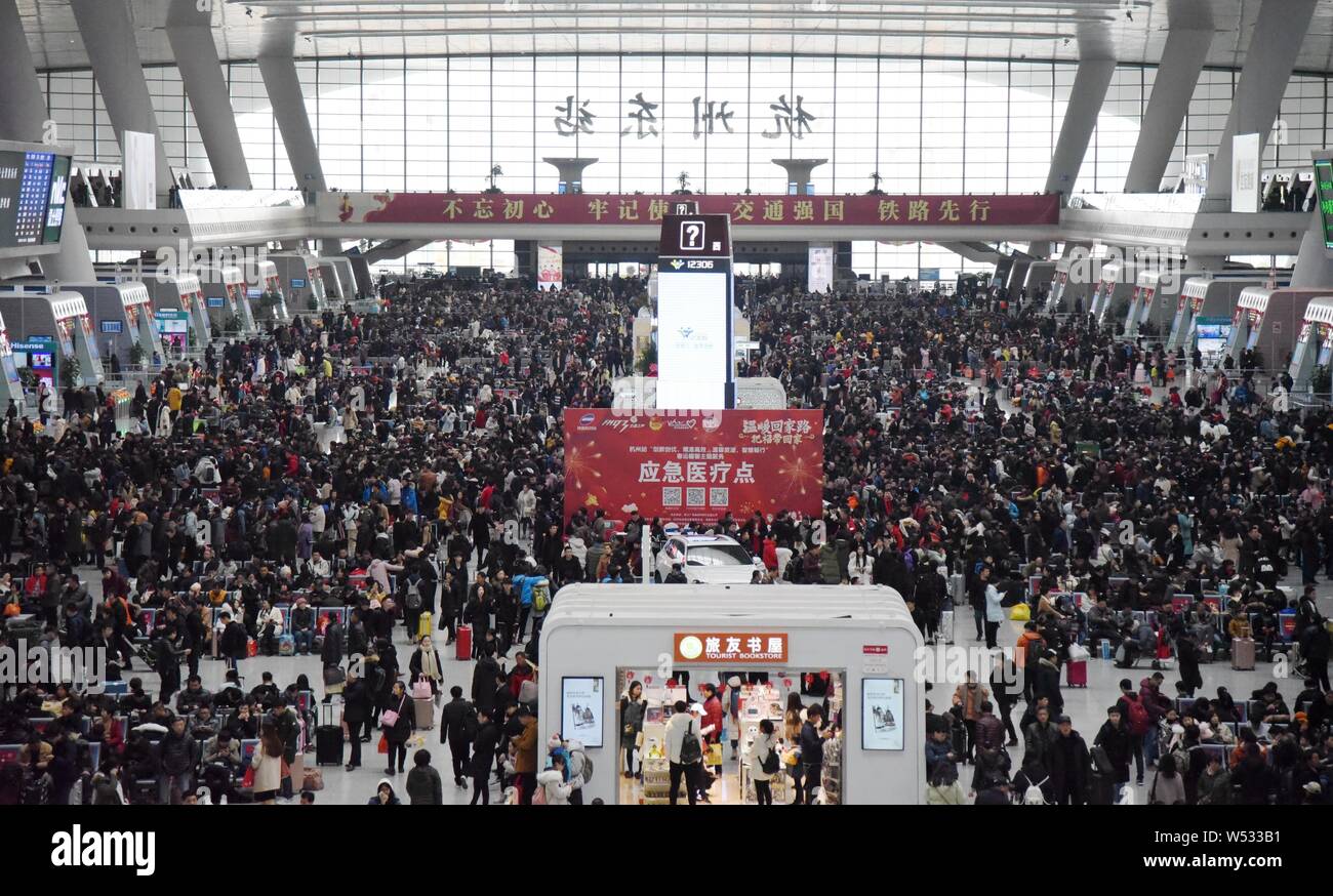 Passengers wait for their trains to go back home for the Chinese Lunar ...