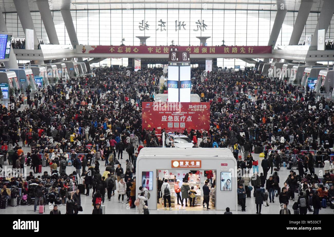 Passengers wait for their trains to go back home for the Chinese Lunar ...