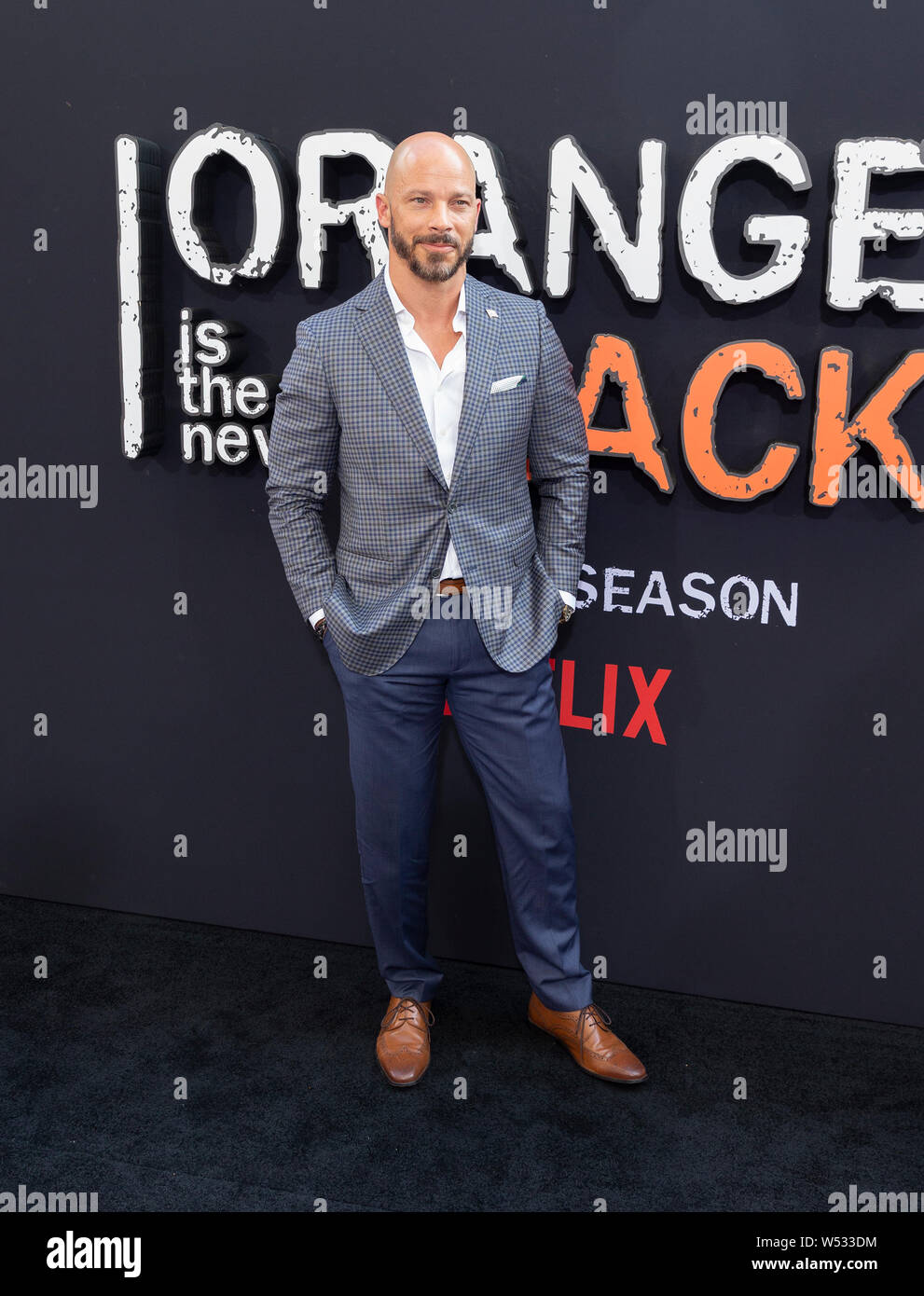 New York, United States. 25th July, 2019. Berto Colon attends "Orange ...