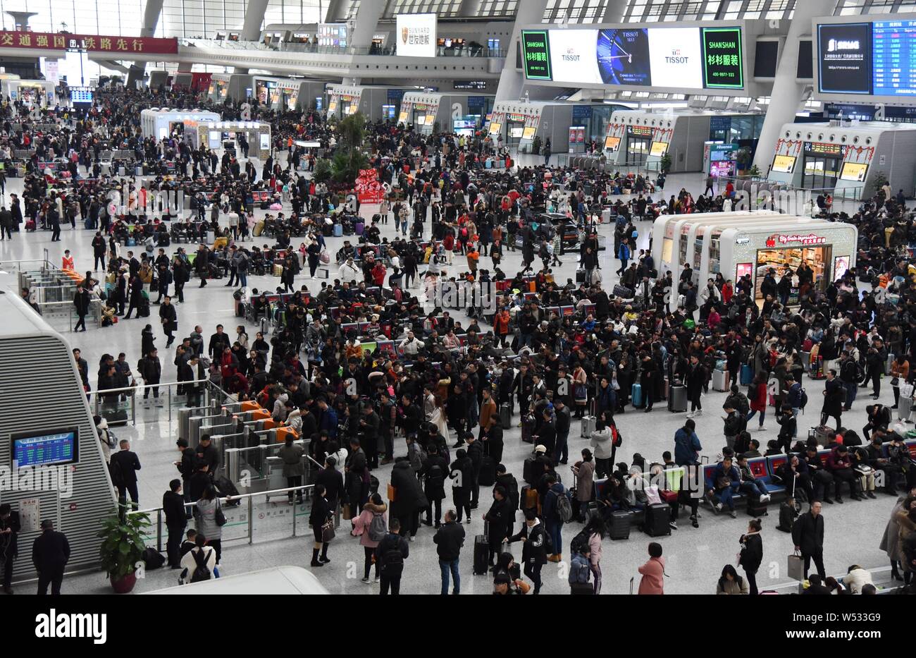 Passengers wait for their trains to go back home for the Chinese Lunar ...