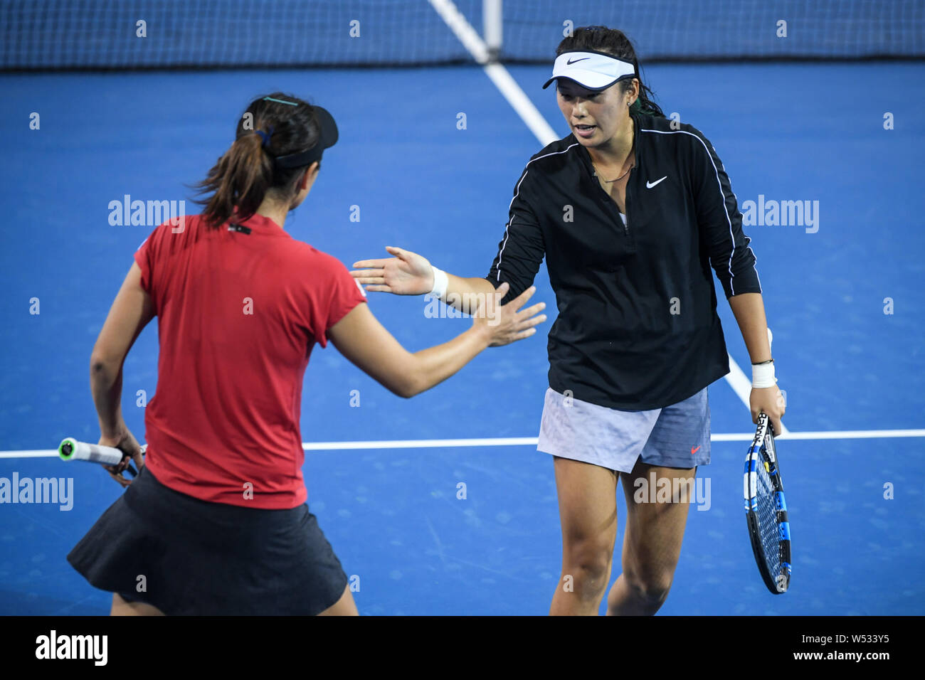 Peng Shuai and Yang Zhaoxuan of China react as they compete against ...
