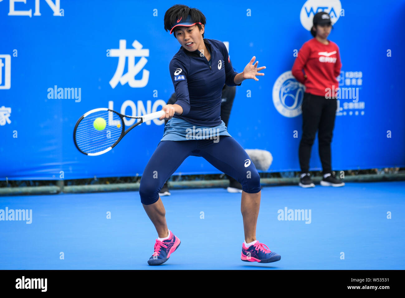 Zhang Shuai of China returns a shot to Ons Jabeur of Tunisia in their ...