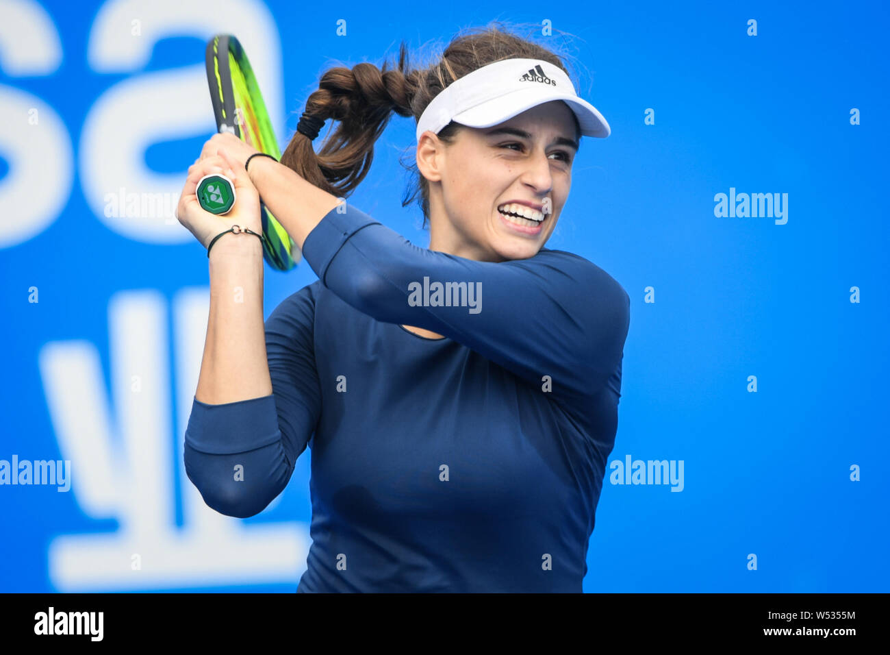 Ivana Jorovic of Serbia returns a shot to Caroline Garcia of France in ...