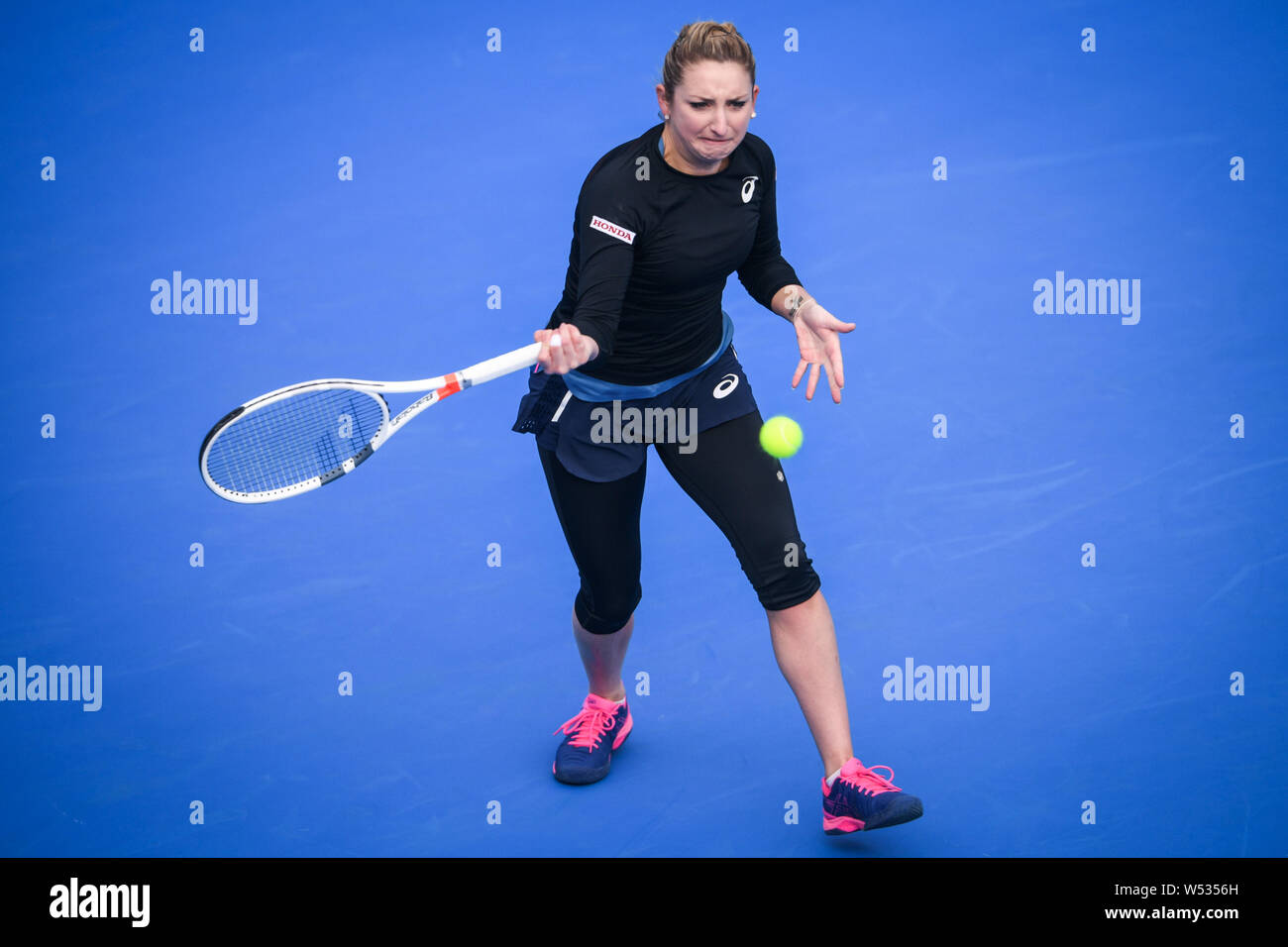 Timea Bacsinszky of Switzerland returns a shot to Maria Sharapova of ...