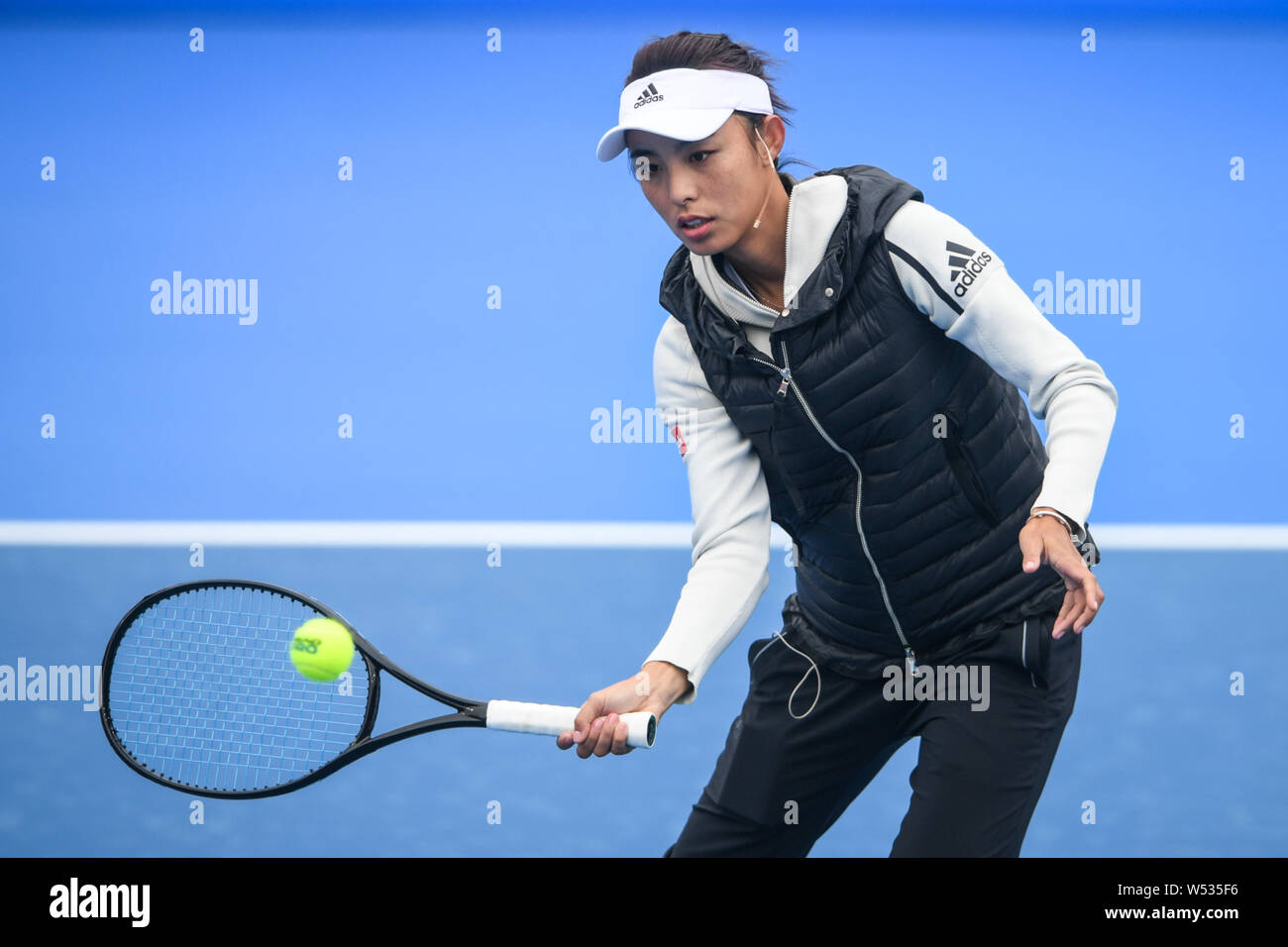 Wang Qiang of China interacts with a little fan ahead of the 2019 WTA ...