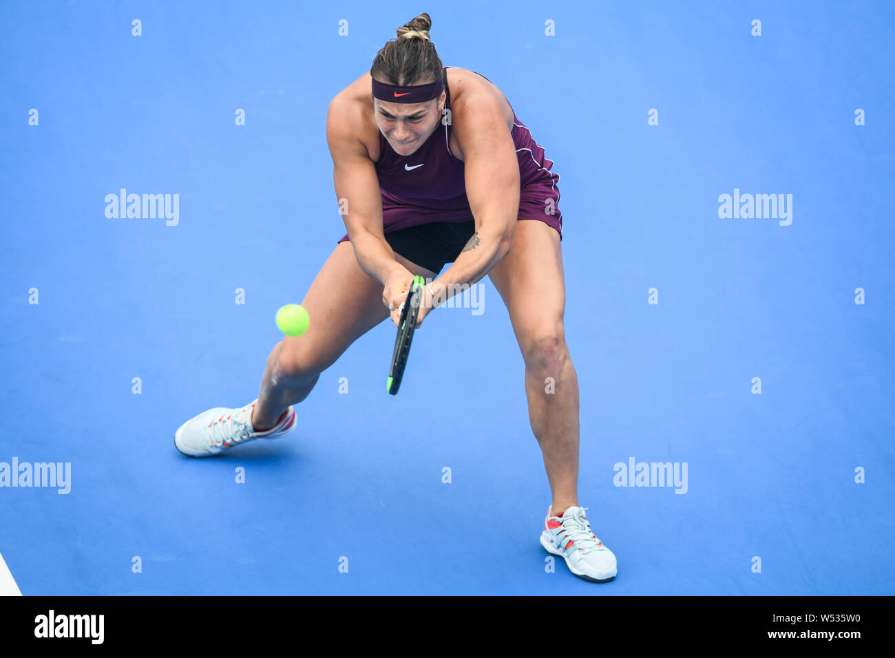 Aryna Sabalenka of Belarus returns a shot to Maria Sharapova of Russia ...