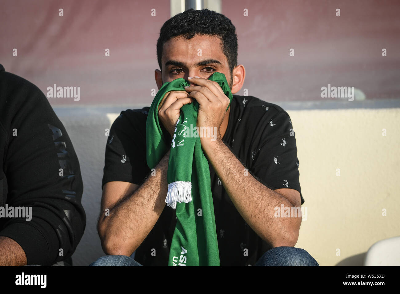 A Saudi Arabian fan weeps after Saudi Arabia national football team was ...
