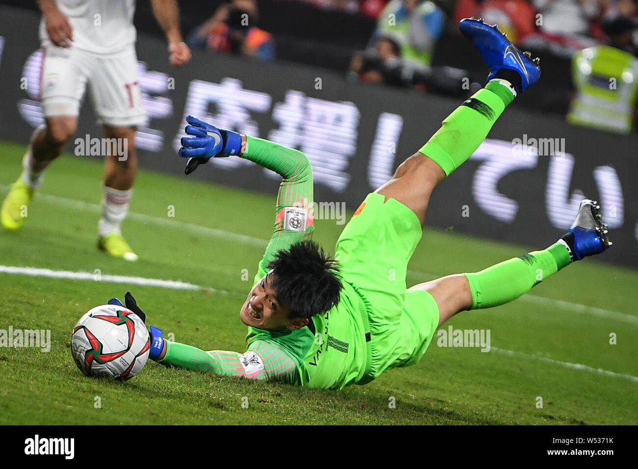 Yan Junling of China tries to save the ball from Iran in their quarter ...