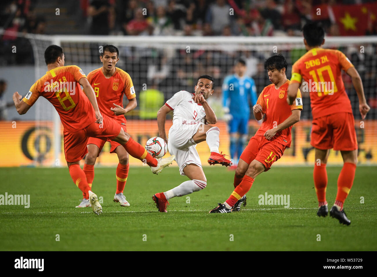Omid Ebrahimi of Iran, center, dribbles against players of China in ...